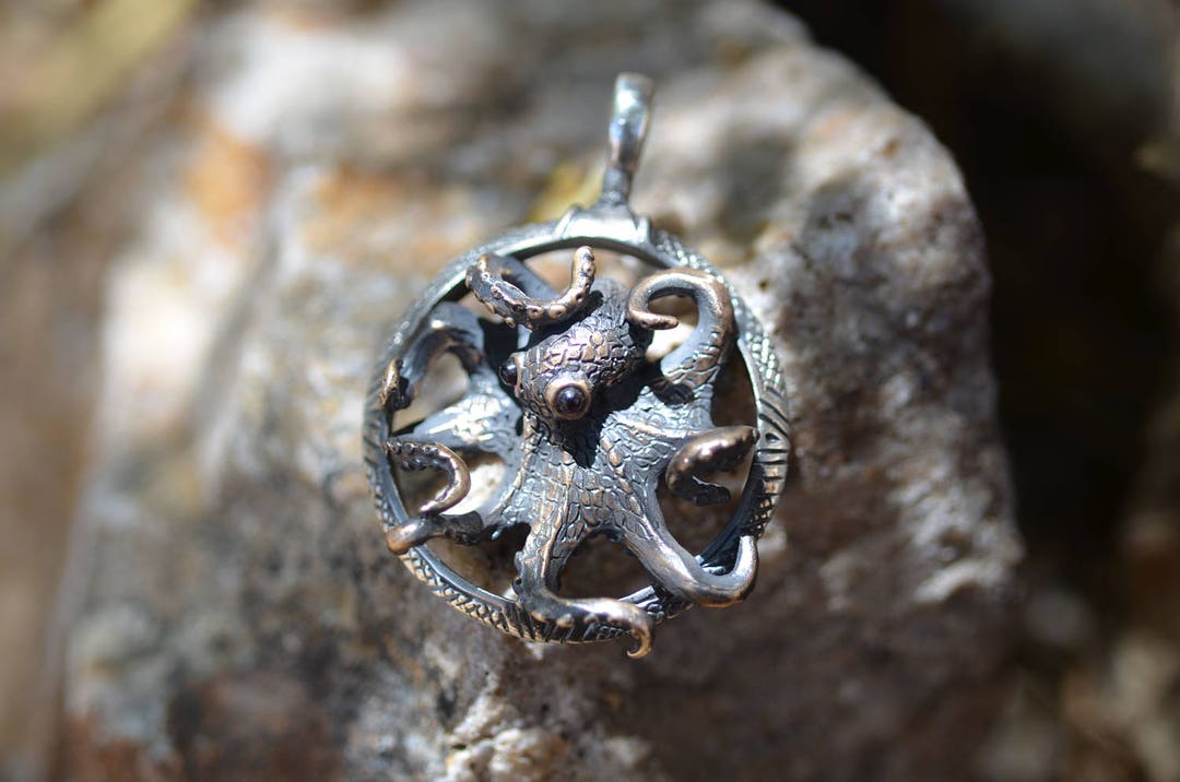 Bronze Octopus Pendant W/ Garnet Eyes in Sterling Silver Ring by Robert ...
