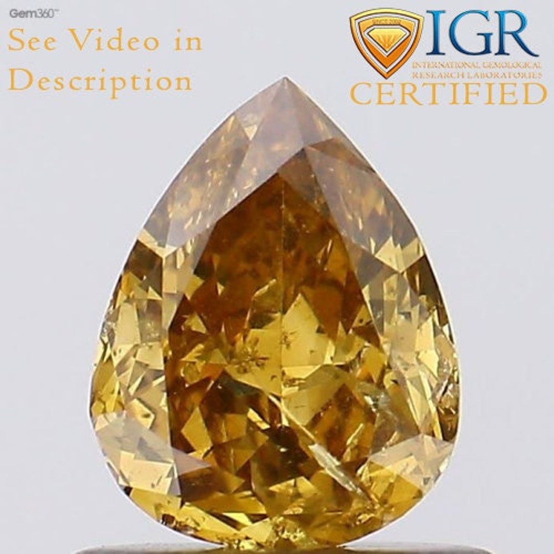 0.66 Cts. CERTIFIED Modified Pear Cut SI3 Vivid Golden Orange Color ...