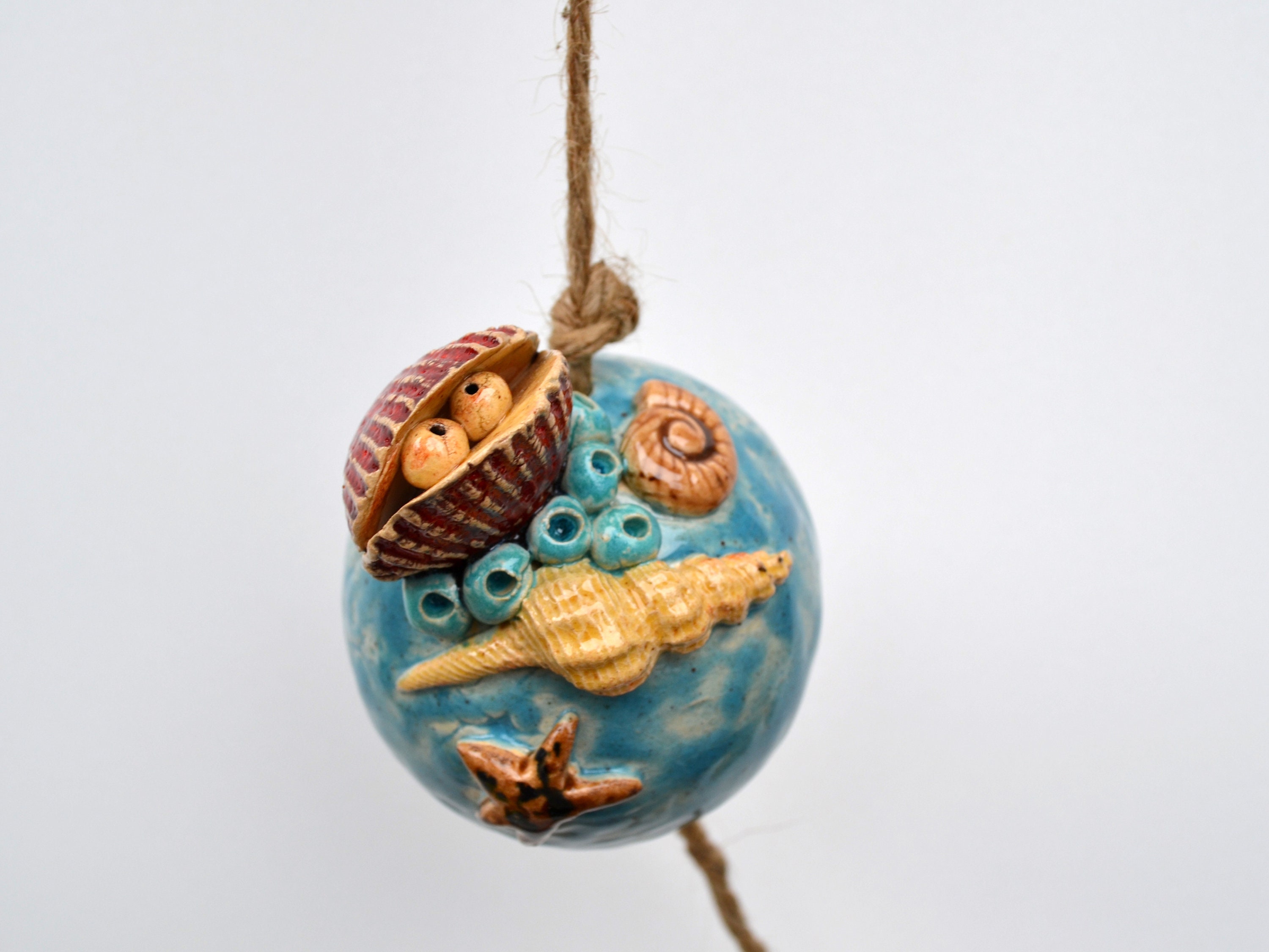 Ceramic ball shells on the beach for hanging