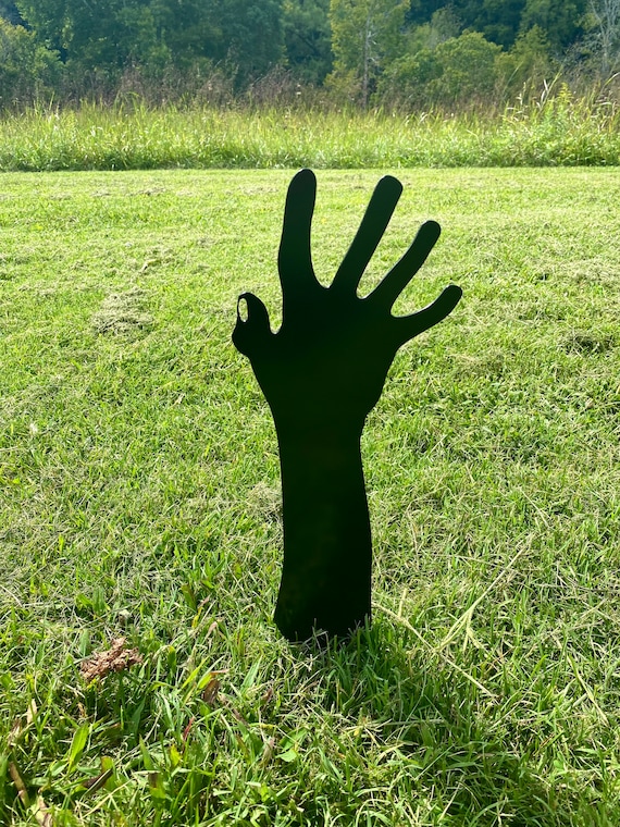 Hand Reaching Out Of Ground