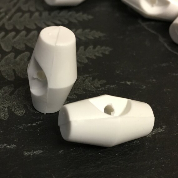 10 white toggles plastic based toggles with one hole | Etsy