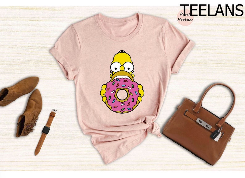 Indulge in Nostalgia: Pocket Homer Simpson Eating Donut Shirt Perfect ...