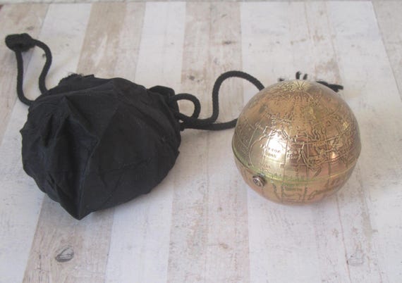 Vintage Pygmalion gold-tone Map of the World Globe co… - Gem