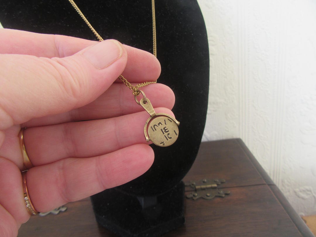 Vintage Brass Spinning Secret Message Pendant and Chain. Message Reads ...