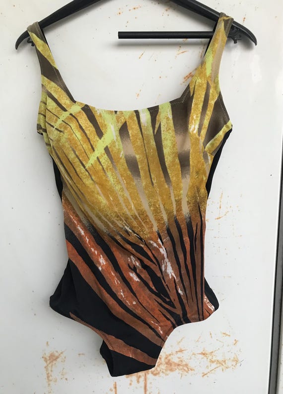 One piece 90s vintage swimsuit that features tribal, … - Gem