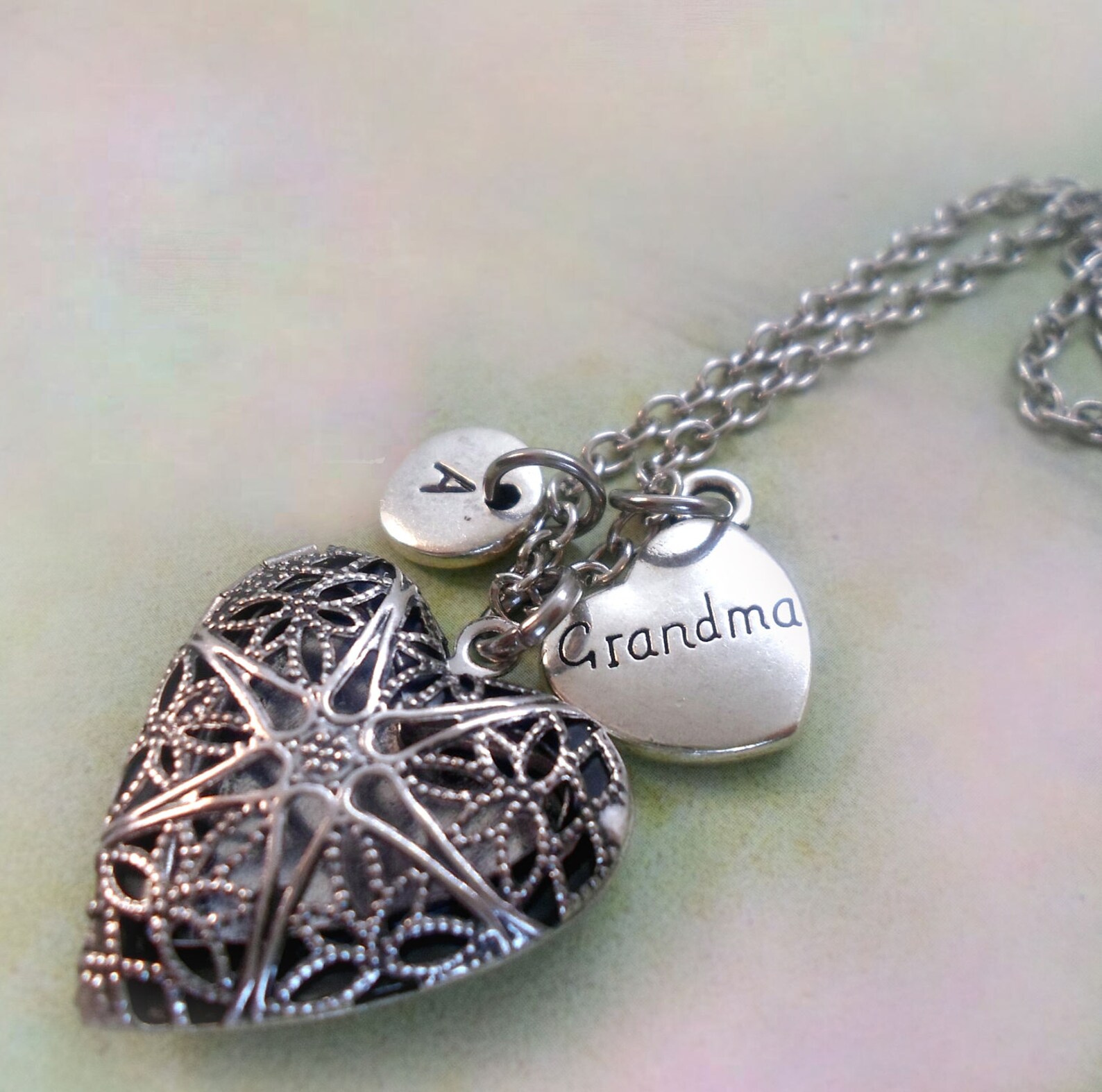 Lovely Filigree Heart Locket With Engraved Grandma Heart & Letter Charm ...