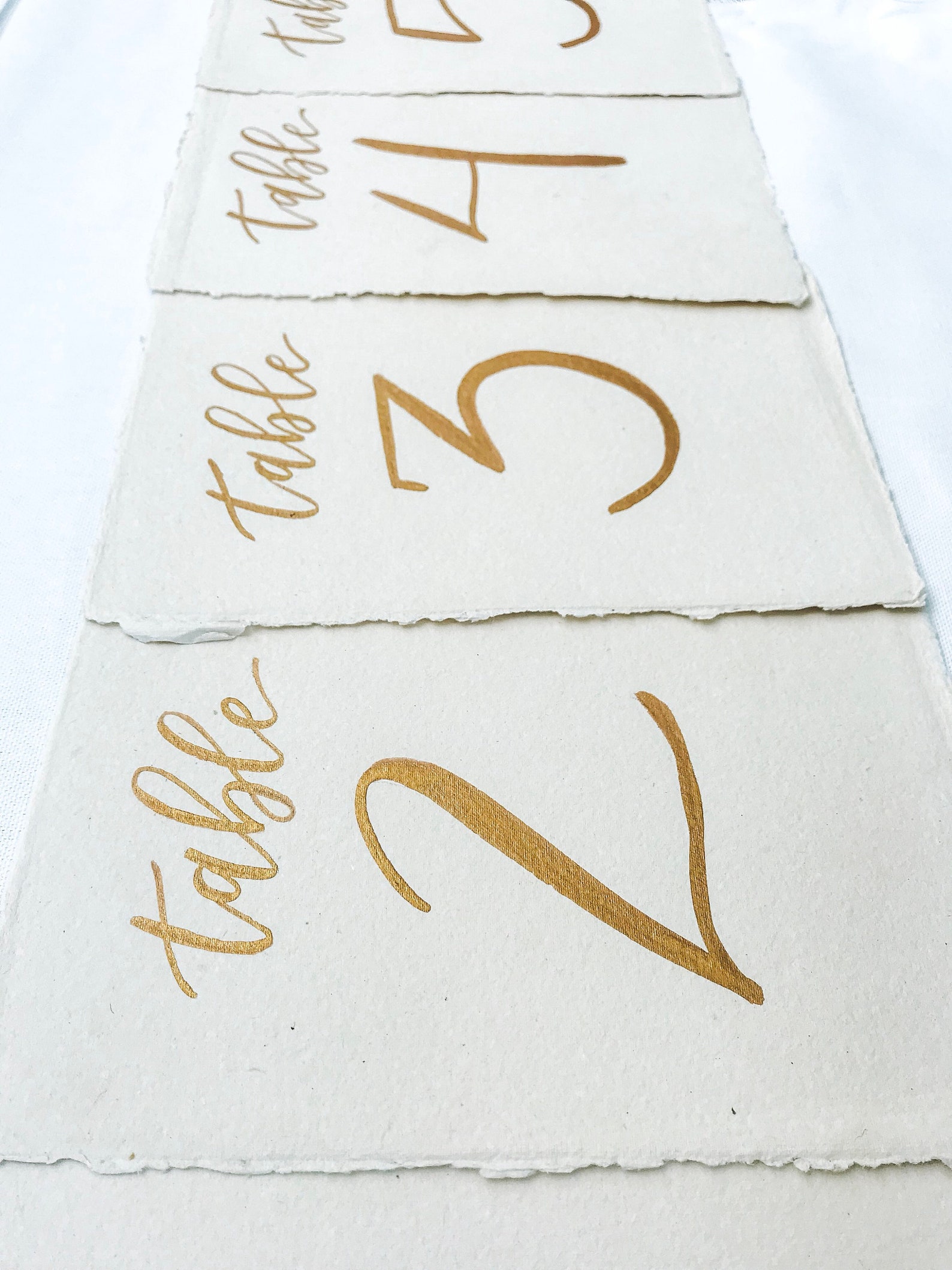 Gold Calligraphy table numbers on hand made paper gold | Etsy