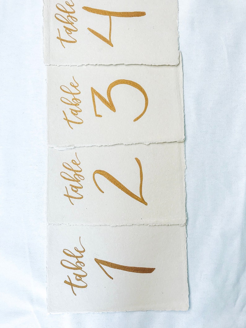 Gold Calligraphy table numbers on hand made paper gold | Etsy