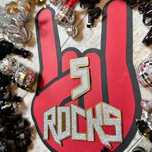 One Rocks Born to Rock Free Tattoos Pour Some Sugar Rock Hand Table ...