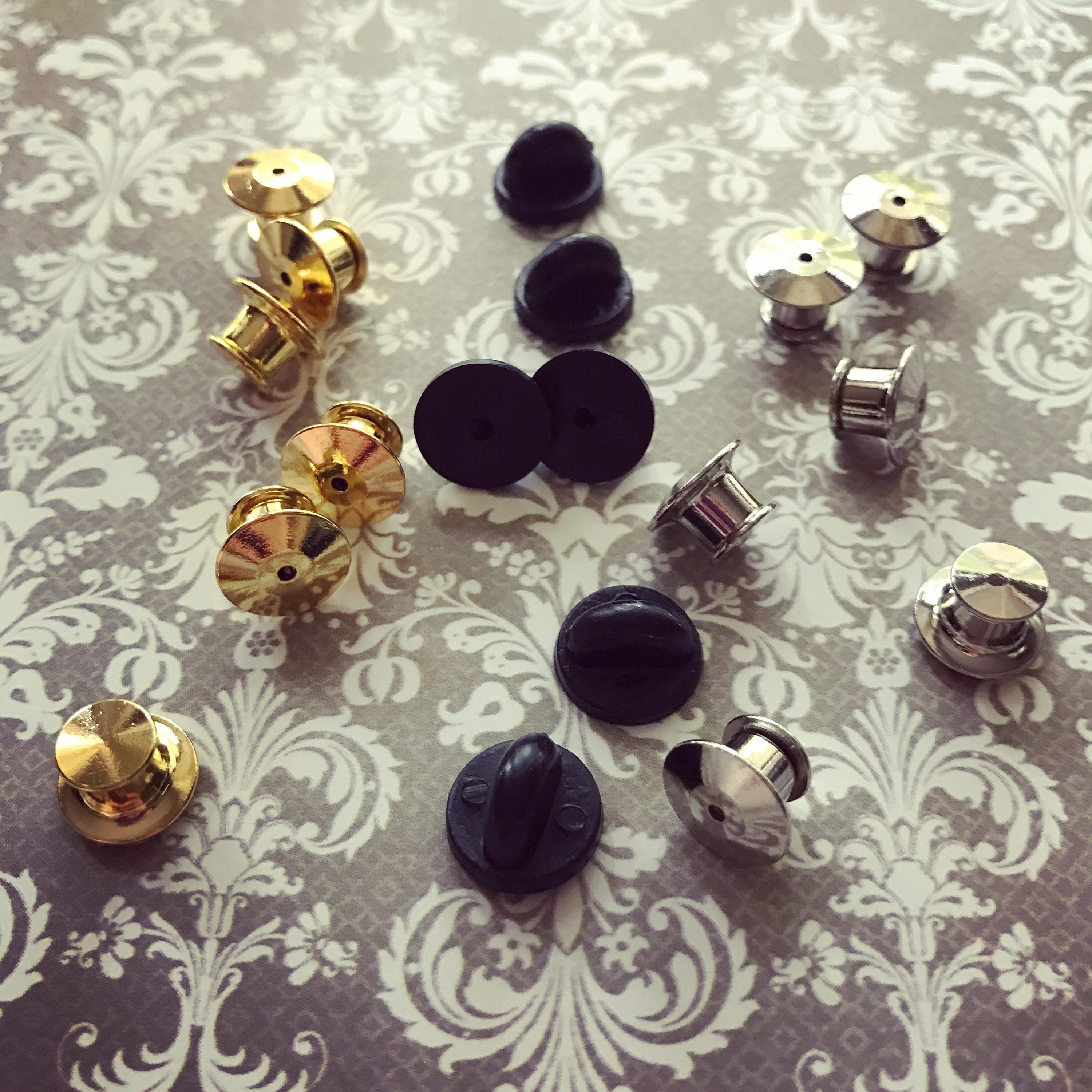 Locking and Rubber Pin Backs