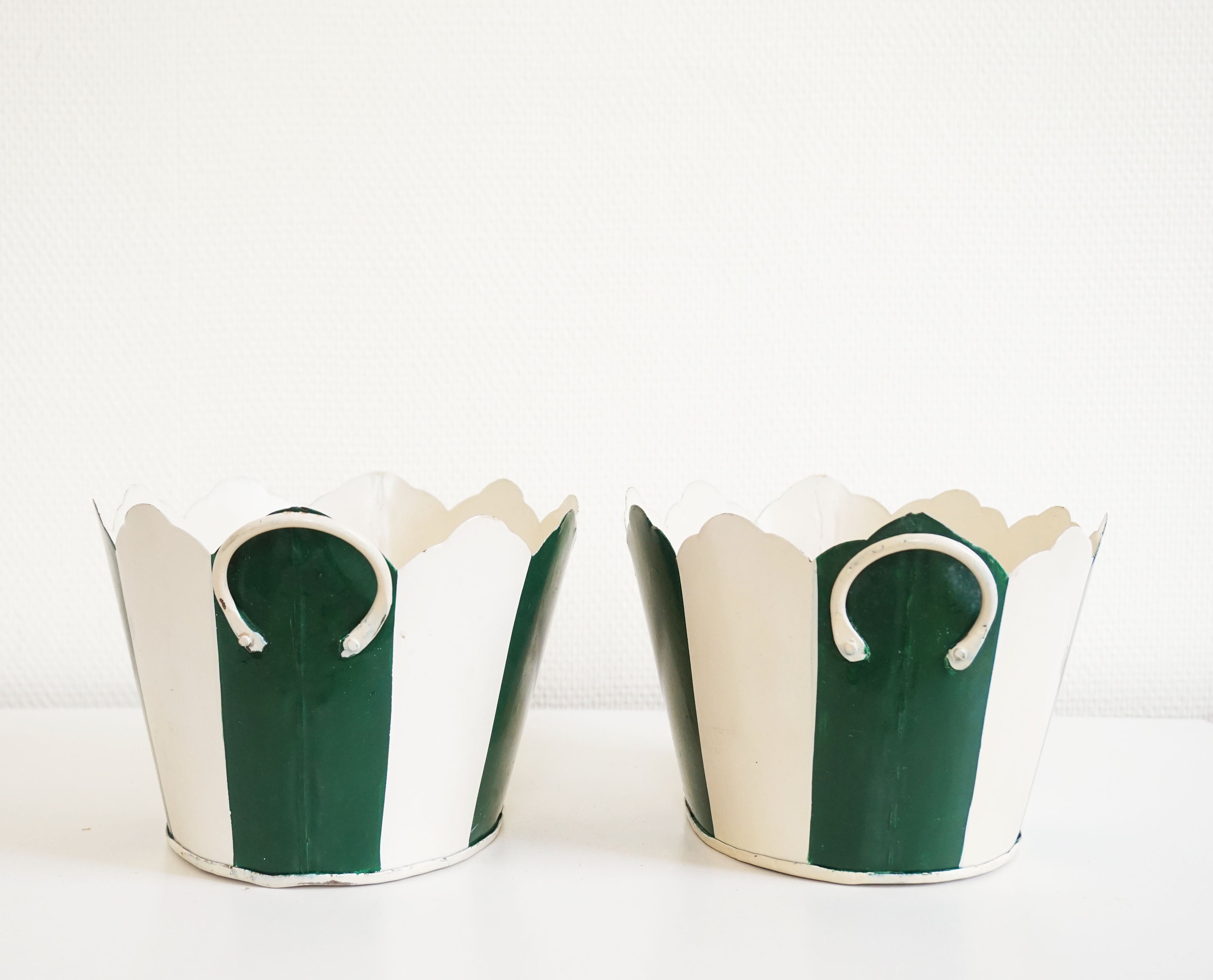 Both green and white striped vintage metal pot covers