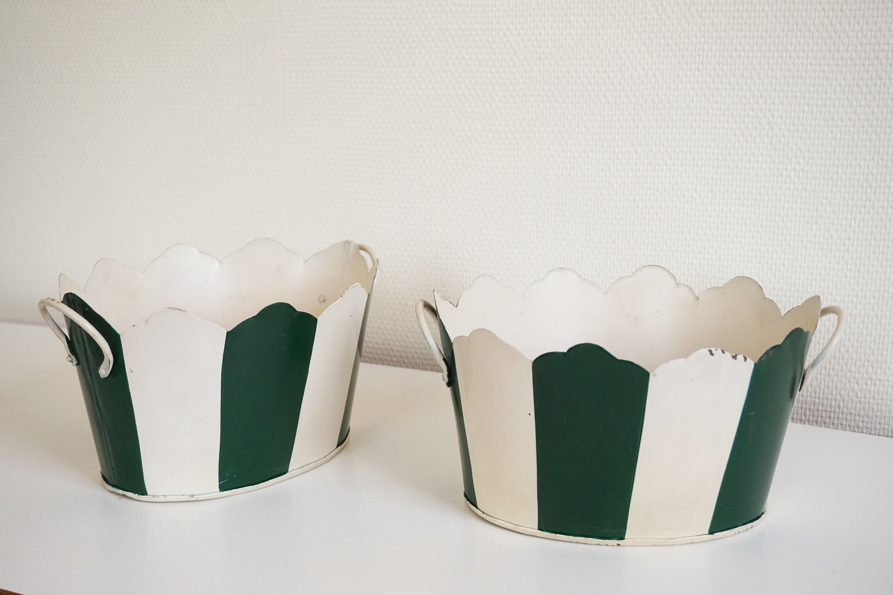 Both green and white striped vintage metal pot covers