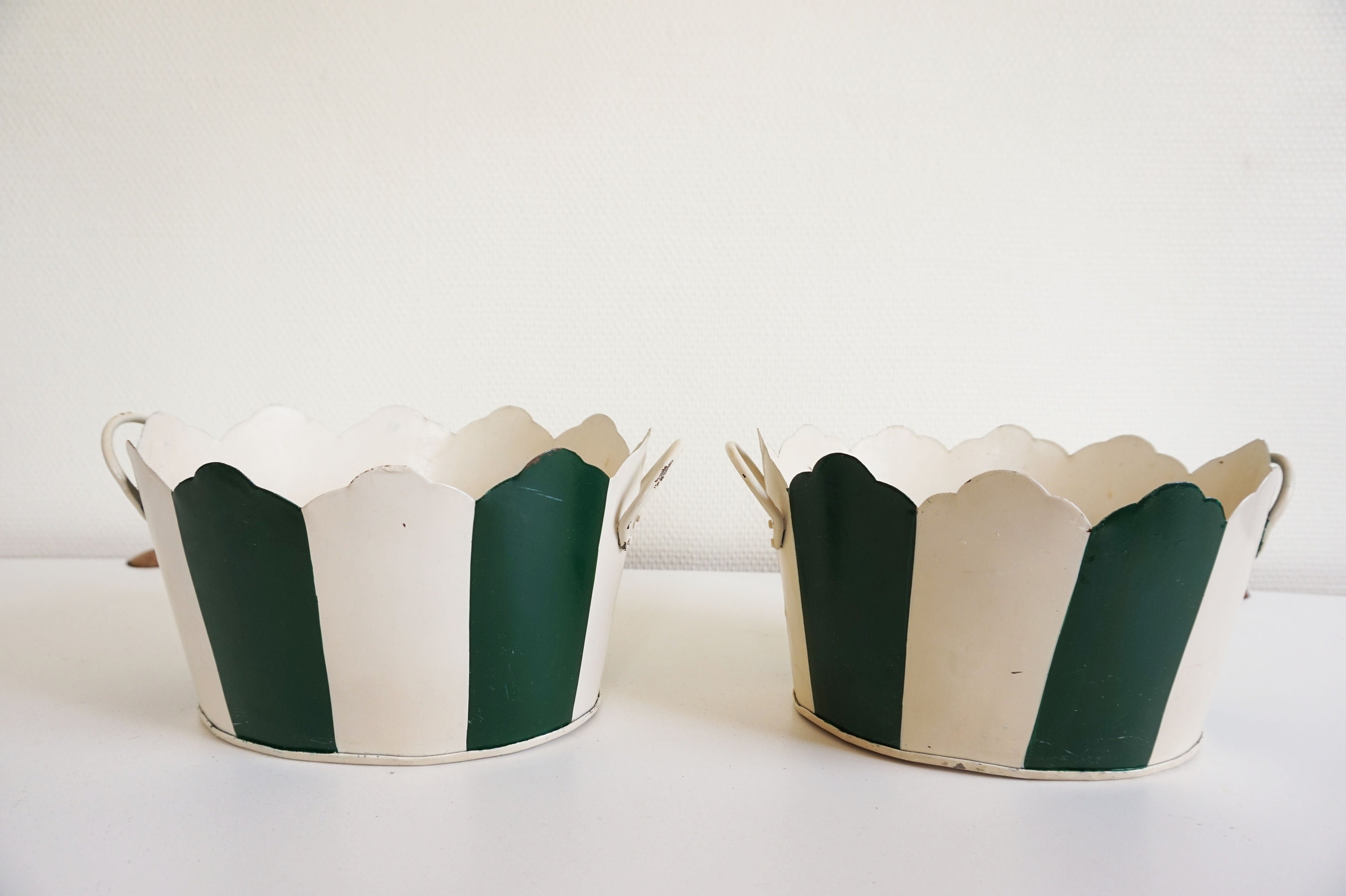Both green and white striped vintage metal pot covers