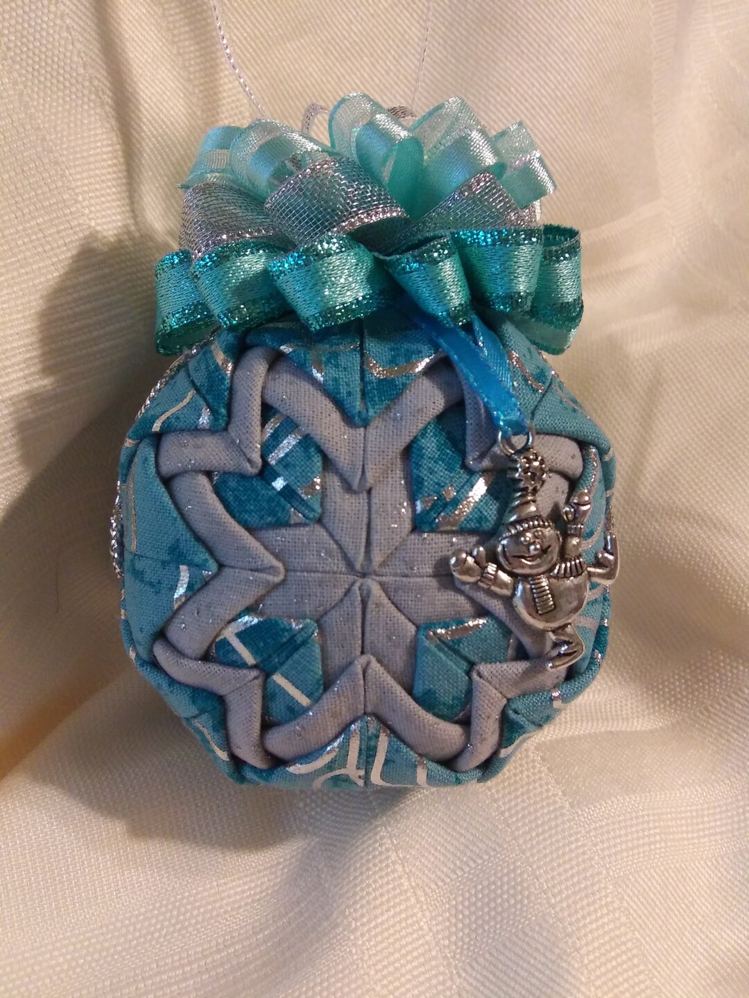 Silver and Teal Fabrics Folded Star Ball Ornament With a Jolly Snowman ...