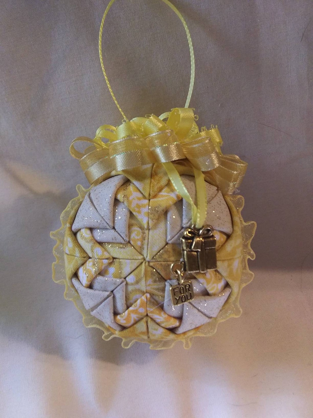 Gold and Yellow Fabrics Folded Star Ball Ornament With a Gold Gift ...