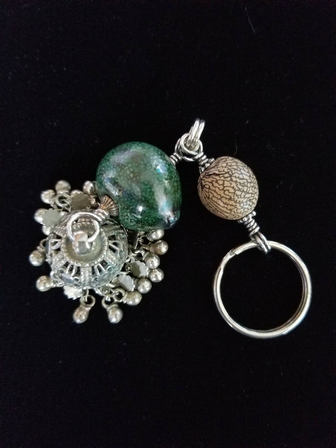 Key Chain. 3 Pieces. Top Piece is a Rain Forest Seed. the Second Piece ...