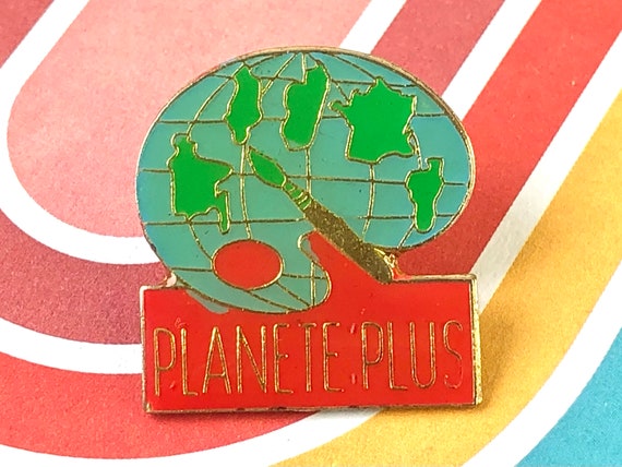 Planet Earth pin, with "Planete plus" ribbon, paint p… - Gem