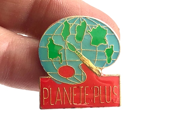 Planet Earth pin, with "Planete plus" ribbon, paint p… - Gem