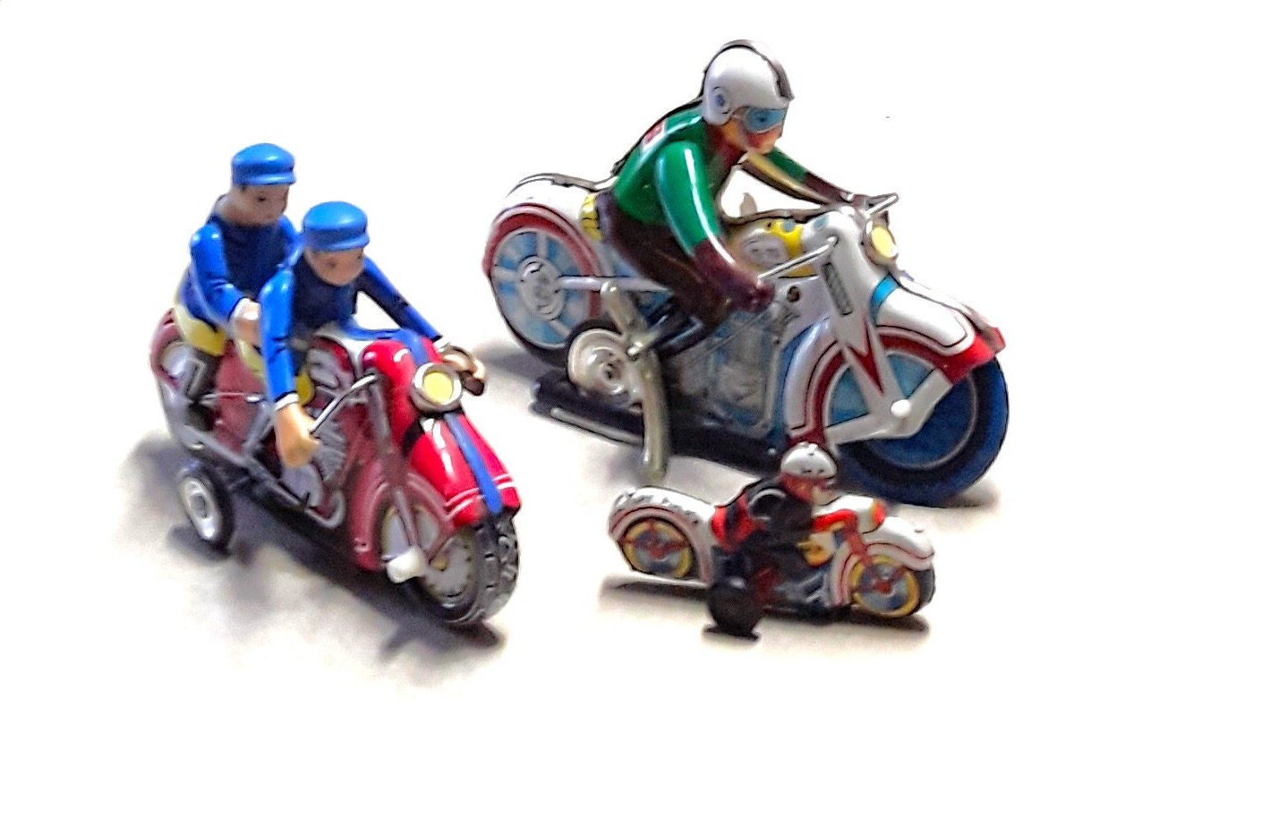 Three Vintage Tin Lithograph Motorcycles with Riders, One Two-rider Toy ...