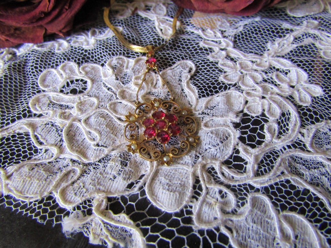 14 Kt. Gold Herringbone 18"chain With a Pink Garnet and Seet Pearl 9 Kt ...