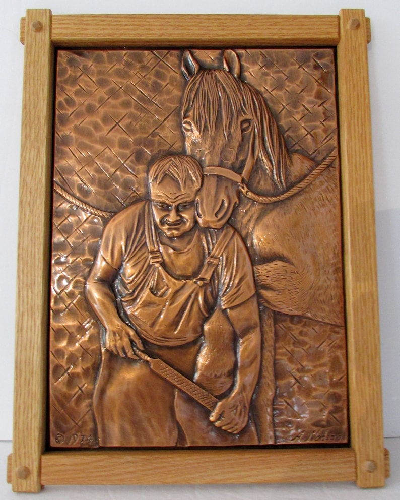 Beautiful hanging embossed copper carving sculpture representing the ...