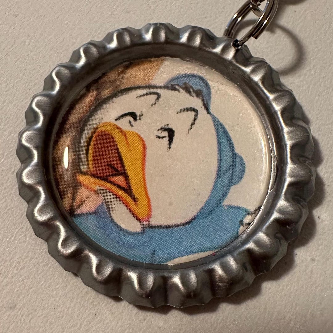 Dewey Duck Crying/sad Face Silver Bottle Cap Keychain With a White ...