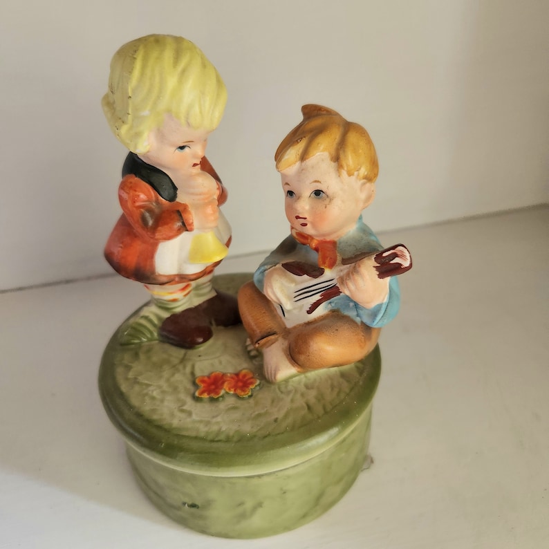 1970 Children's Music Box. Girl and Boy Playing Musical Instruments ...