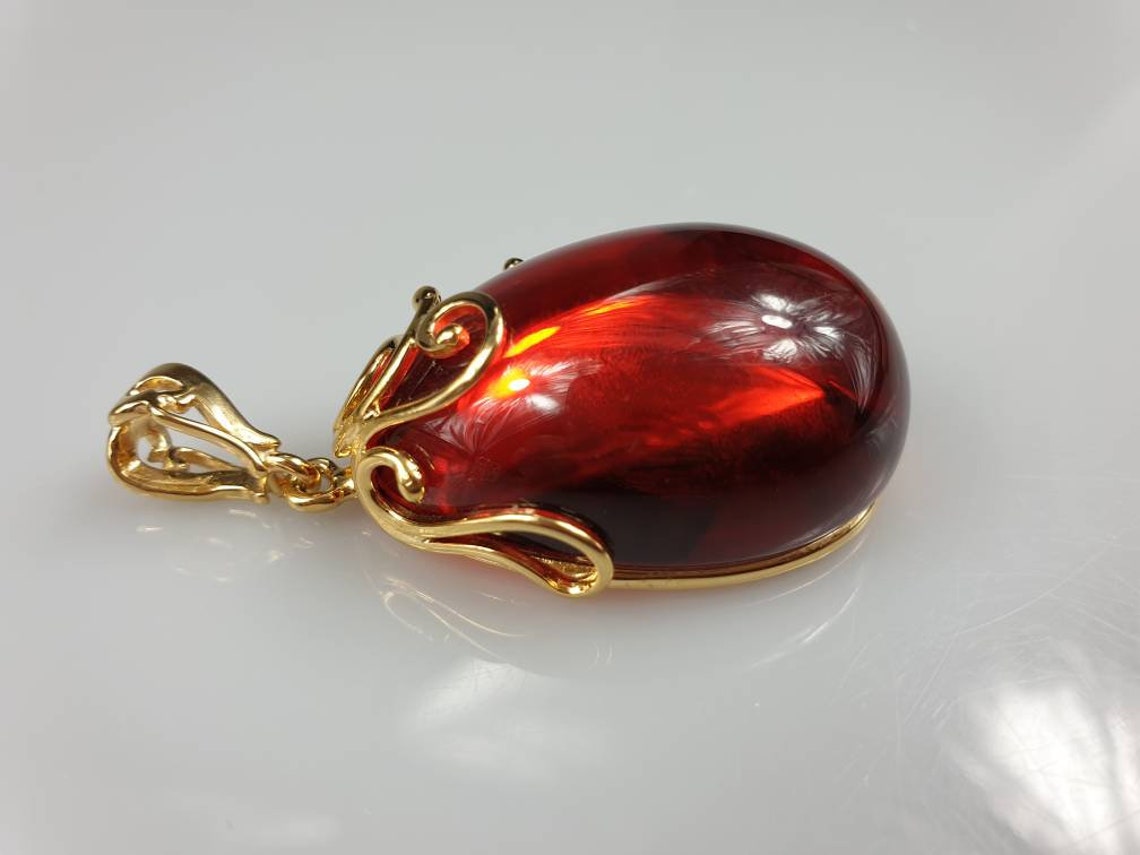 Ruby red Amber pendant. Gold plated silver cabochon. Deep red | Etsy