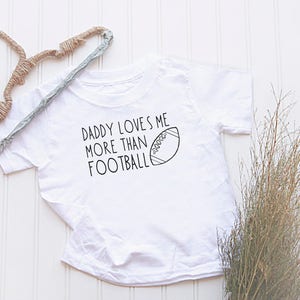 Football Onesie® - Daddy Loves Me More Than Football®, New Dad Onesie ...