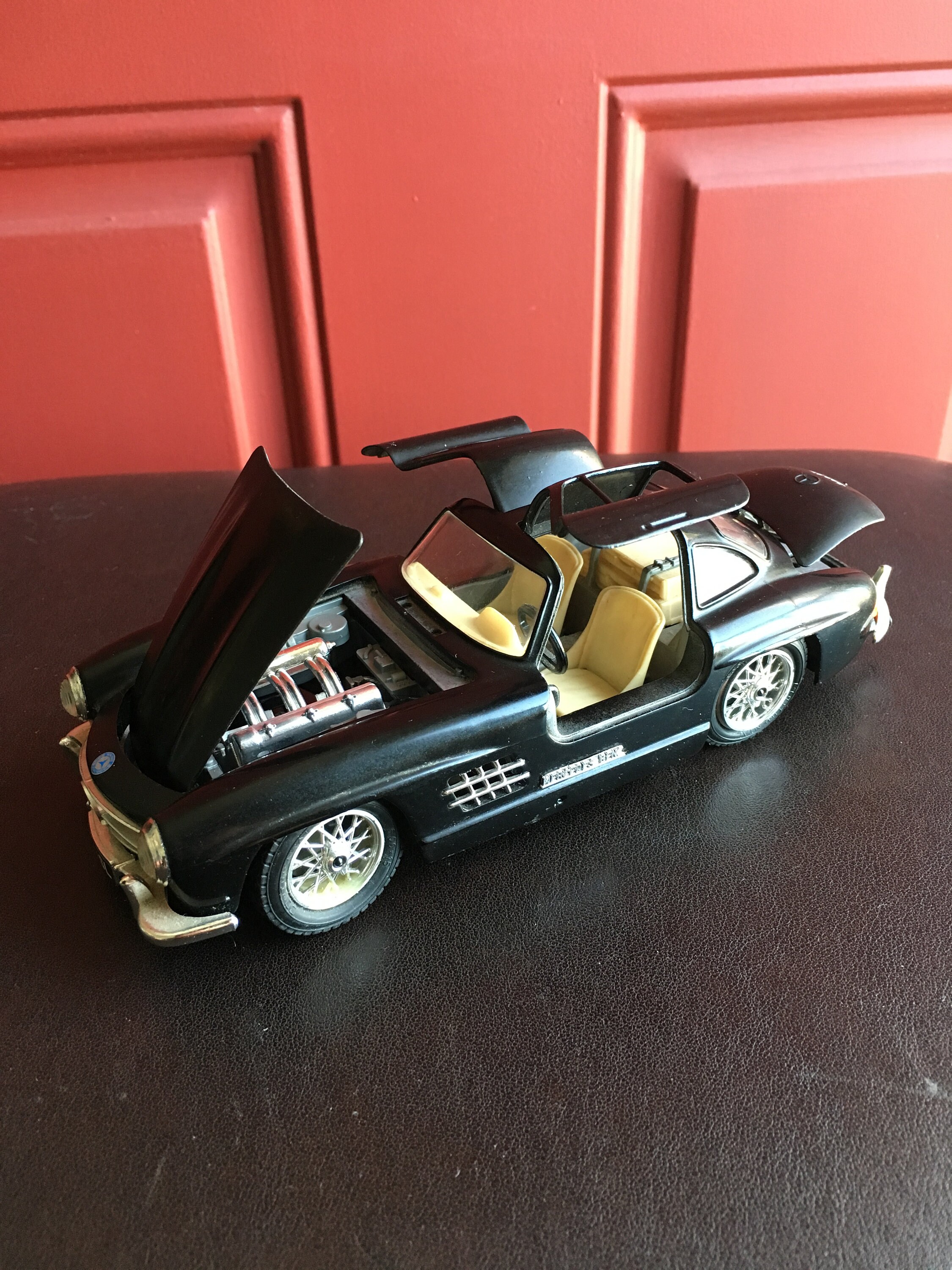 Black Mercedes Benz 300 SL, 1/24 Scale, Die-cast Metal and Black Mercedes Benz 300 SL, 1/24 Scale, Die-cast Metal and