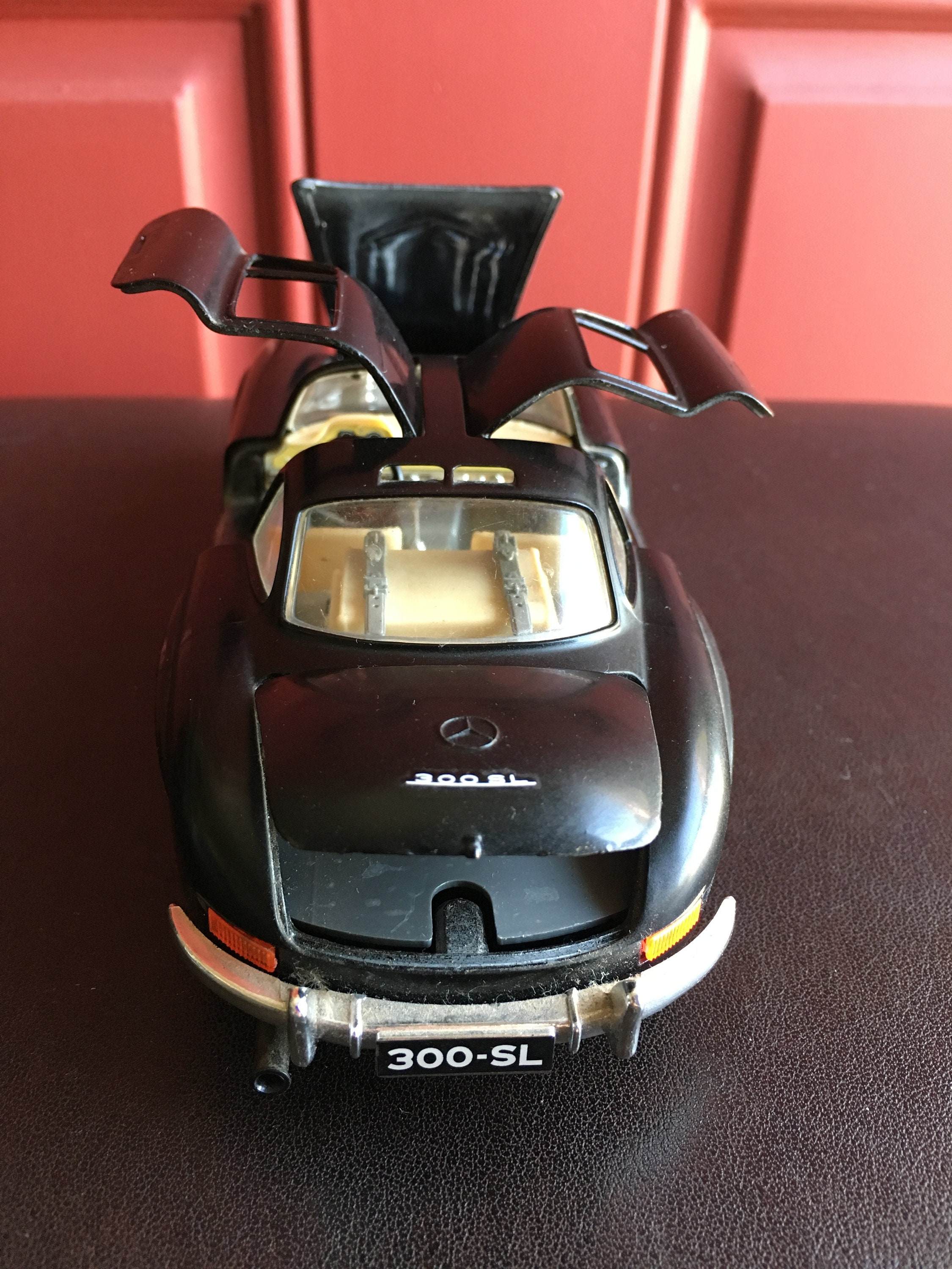 Black Mercedes Benz 300 SL, 1/24 Scale, Die-cast Metal and Black Mercedes Benz 300 SL, 1/24 Scale, Die-cast Metal and
