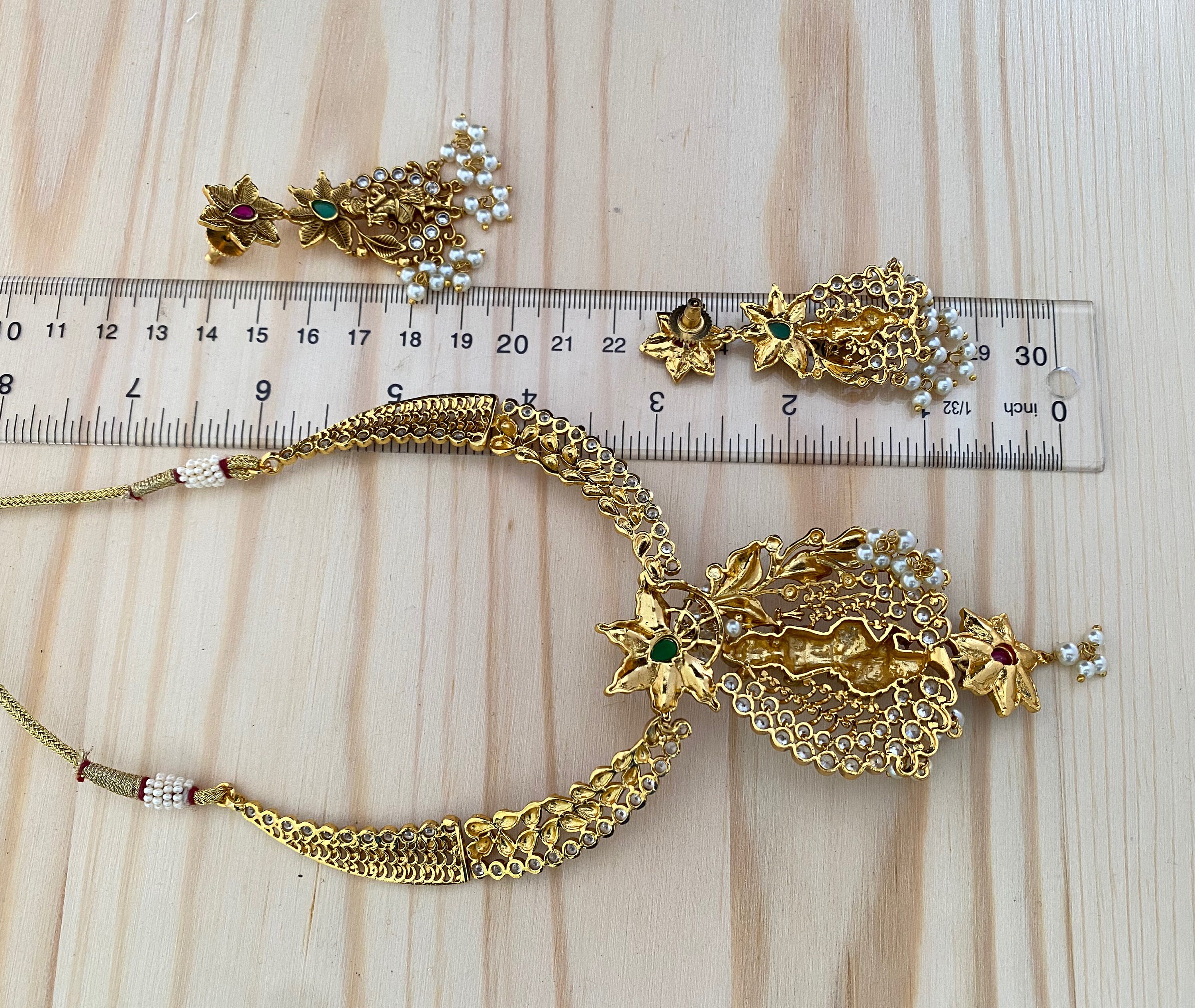 mdbeadworks Matte Gold Finish Lord Krishna Temple Pendant Flute white Stone Hasli Style Necklace Drop and Dangle Earrings South Indian Wedding Jewelry