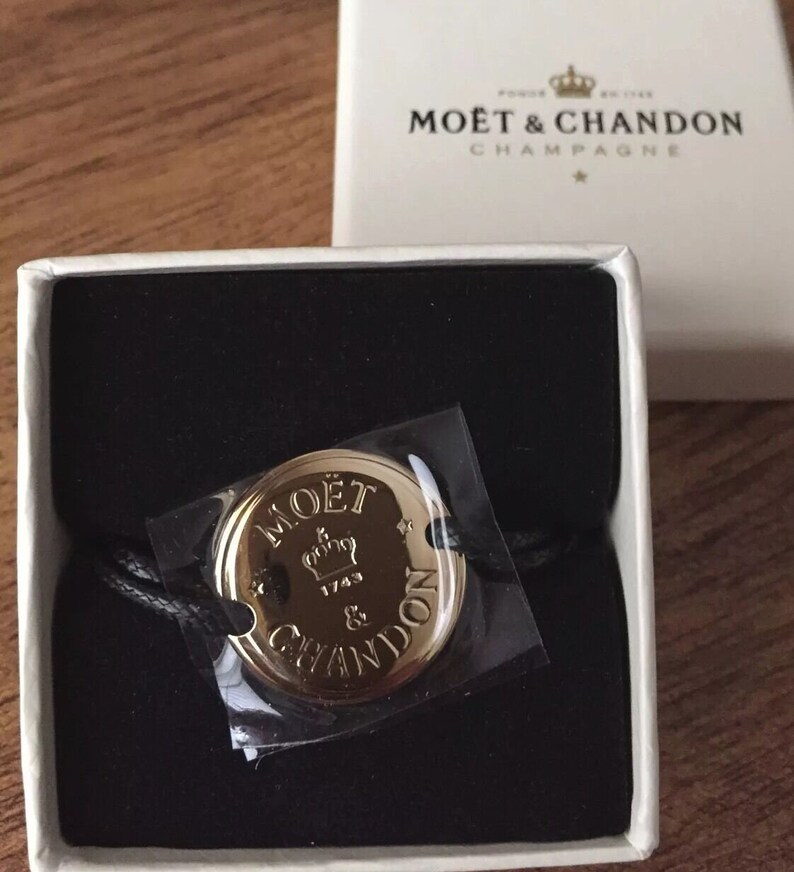 Moet Chandon Champagne Corded Gold Tone Disc Bracelet in Branded Moet ...