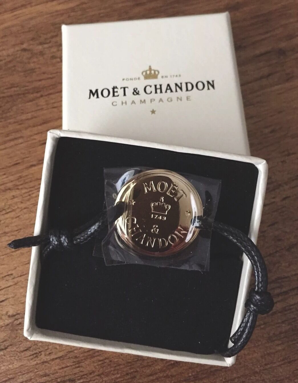 Moet Chandon Champagne Corded Gold Tone Disc Bracelet in Branded Moet ...