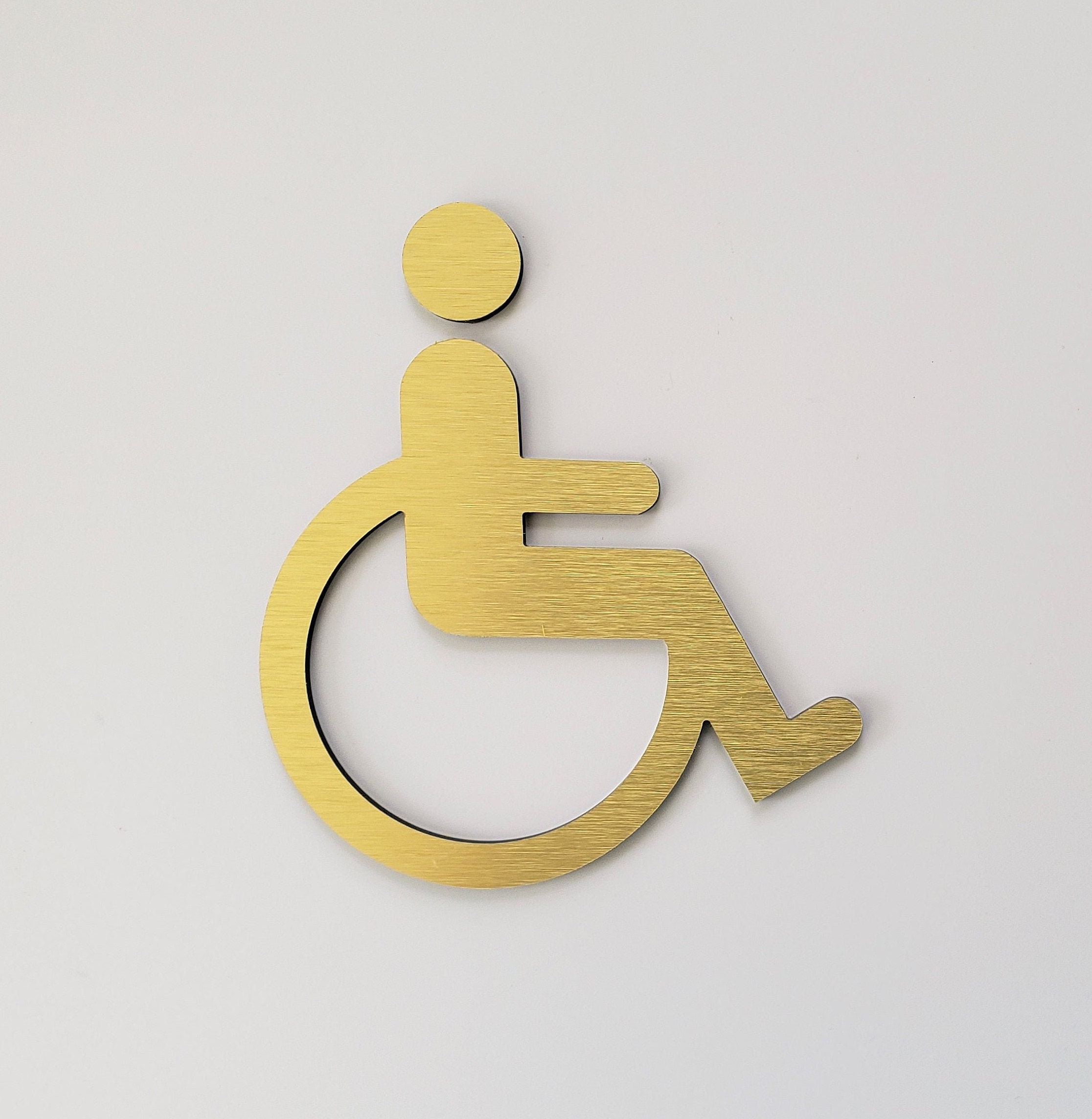Metal handicap figure. Handicap symbol. Bathroom door sign. Fitting ...