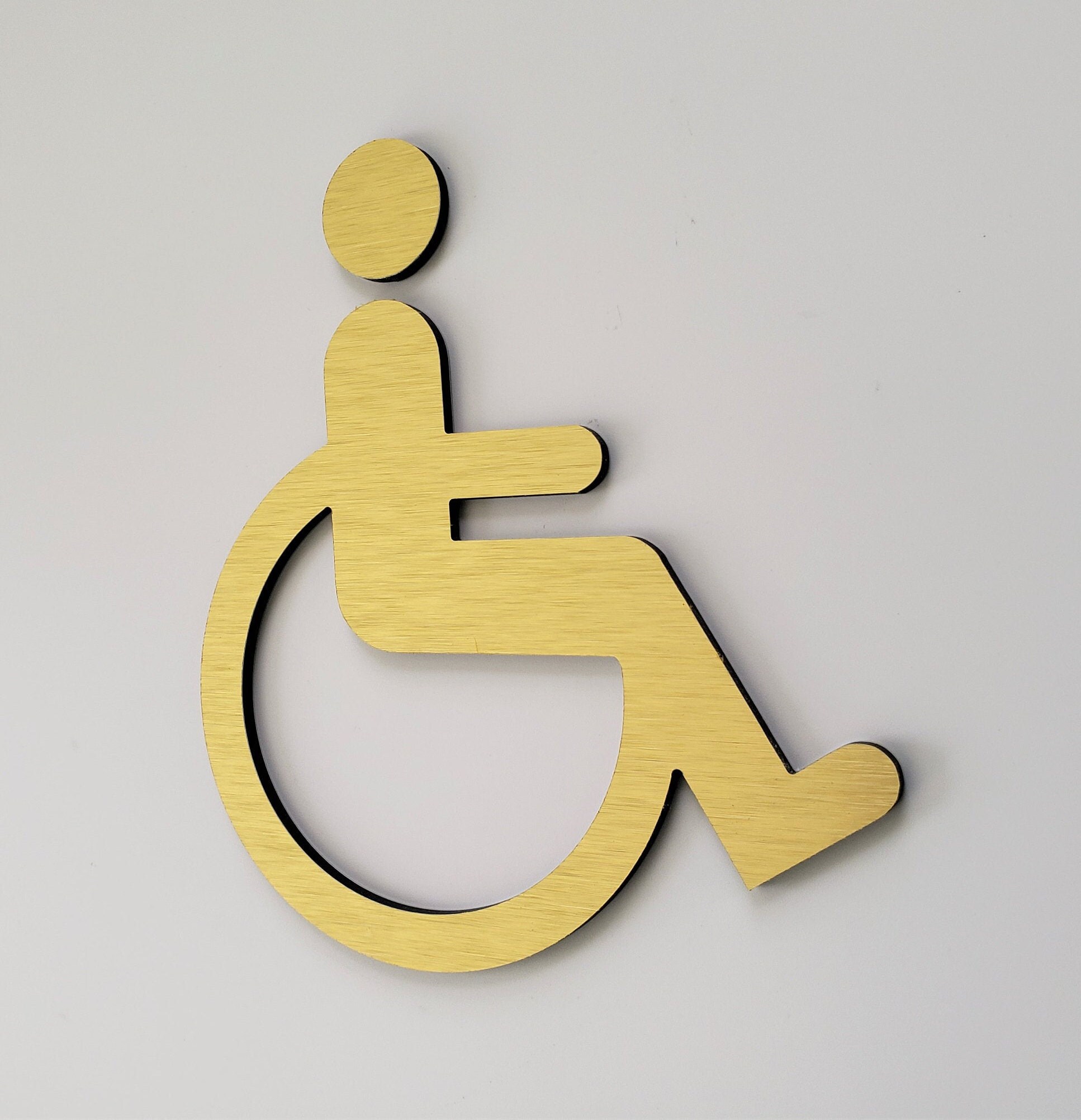 Metal handicap figure. Handicap symbol. Bathroom door sign. Fitting ...