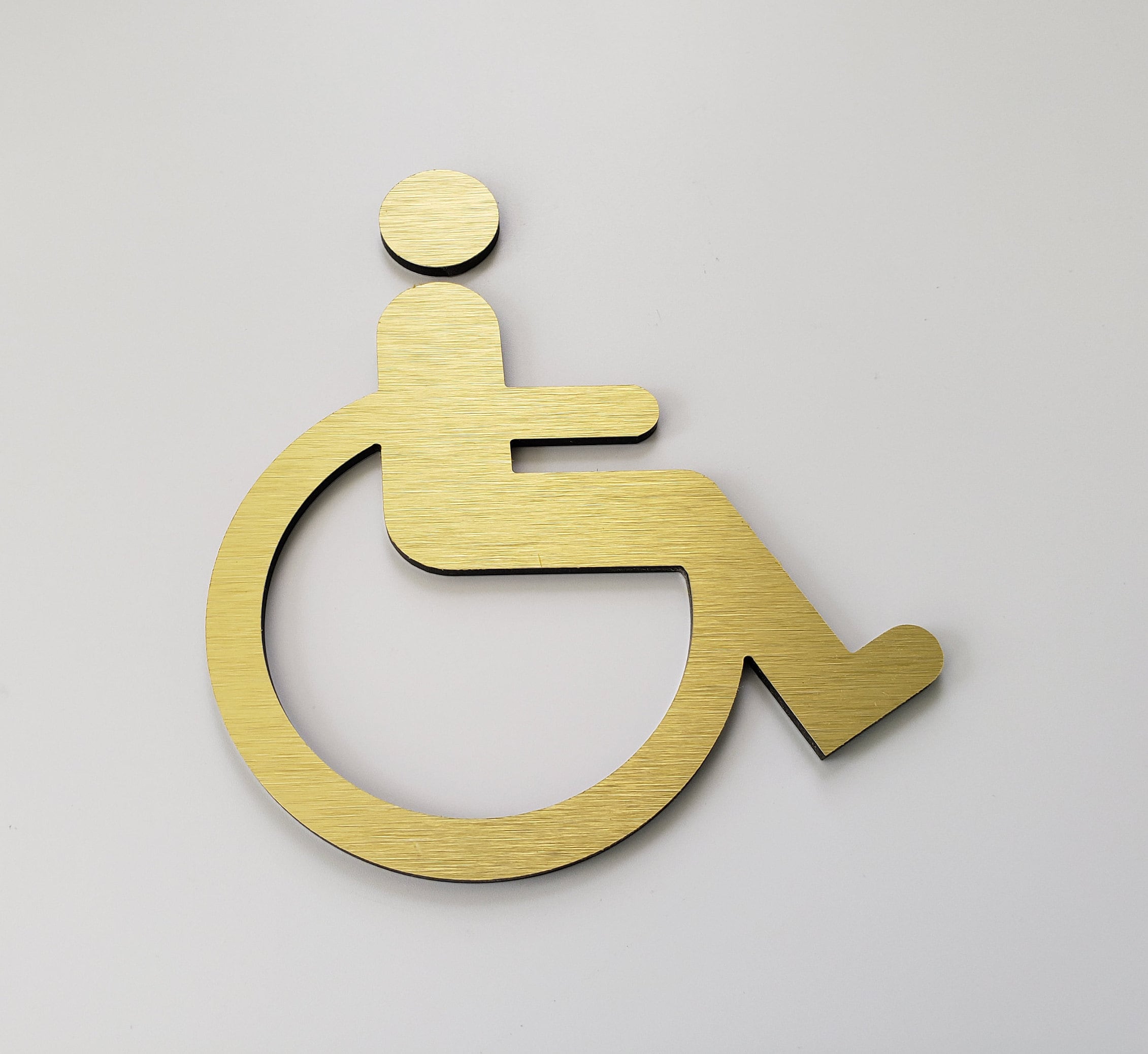 Metal handicap figure. Handicap symbol. Bathroom door sign. Fitting ...