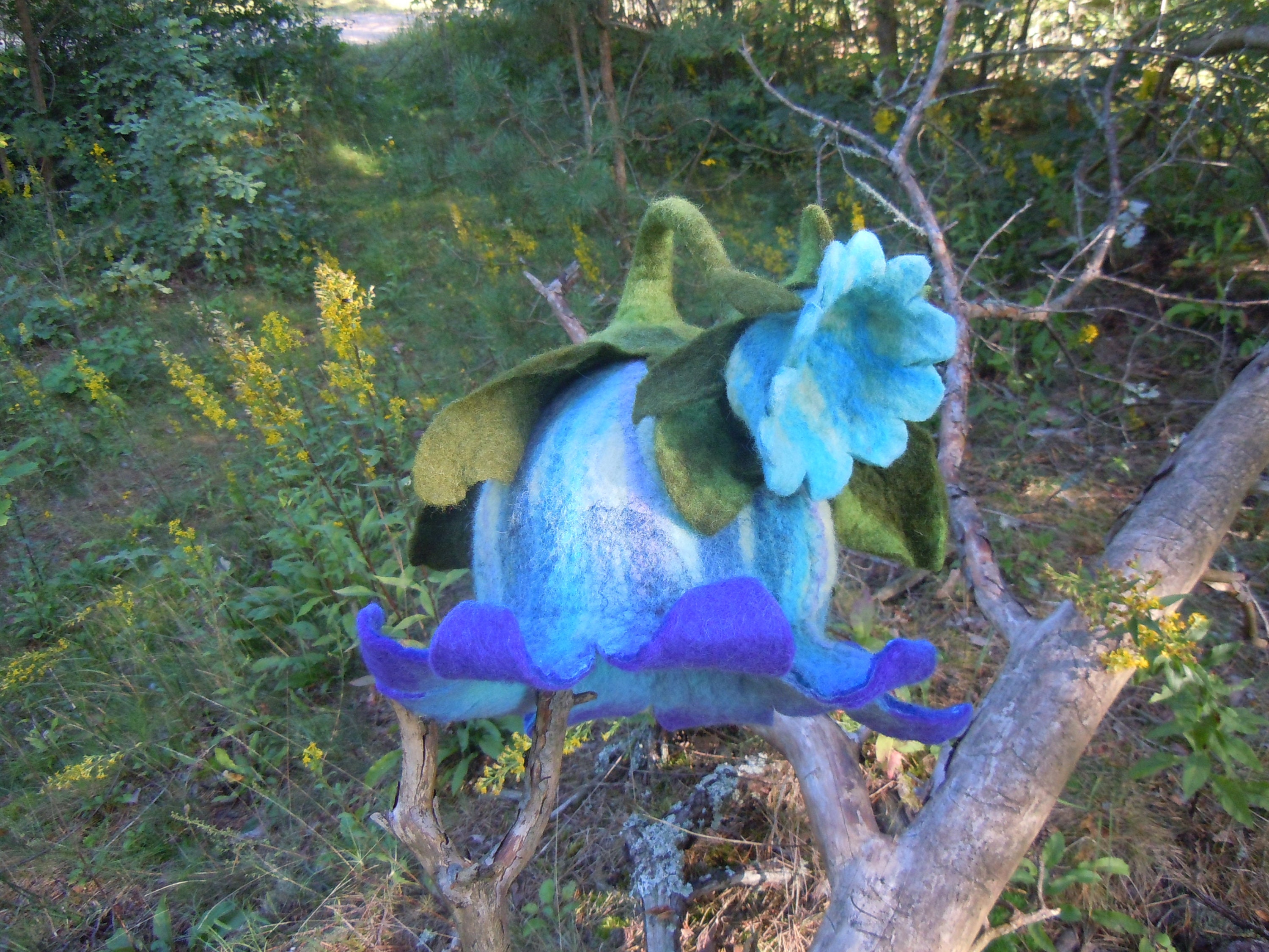 Blue Beautiful Bell Shaped Hat With a Little Flower at the End Flower ...