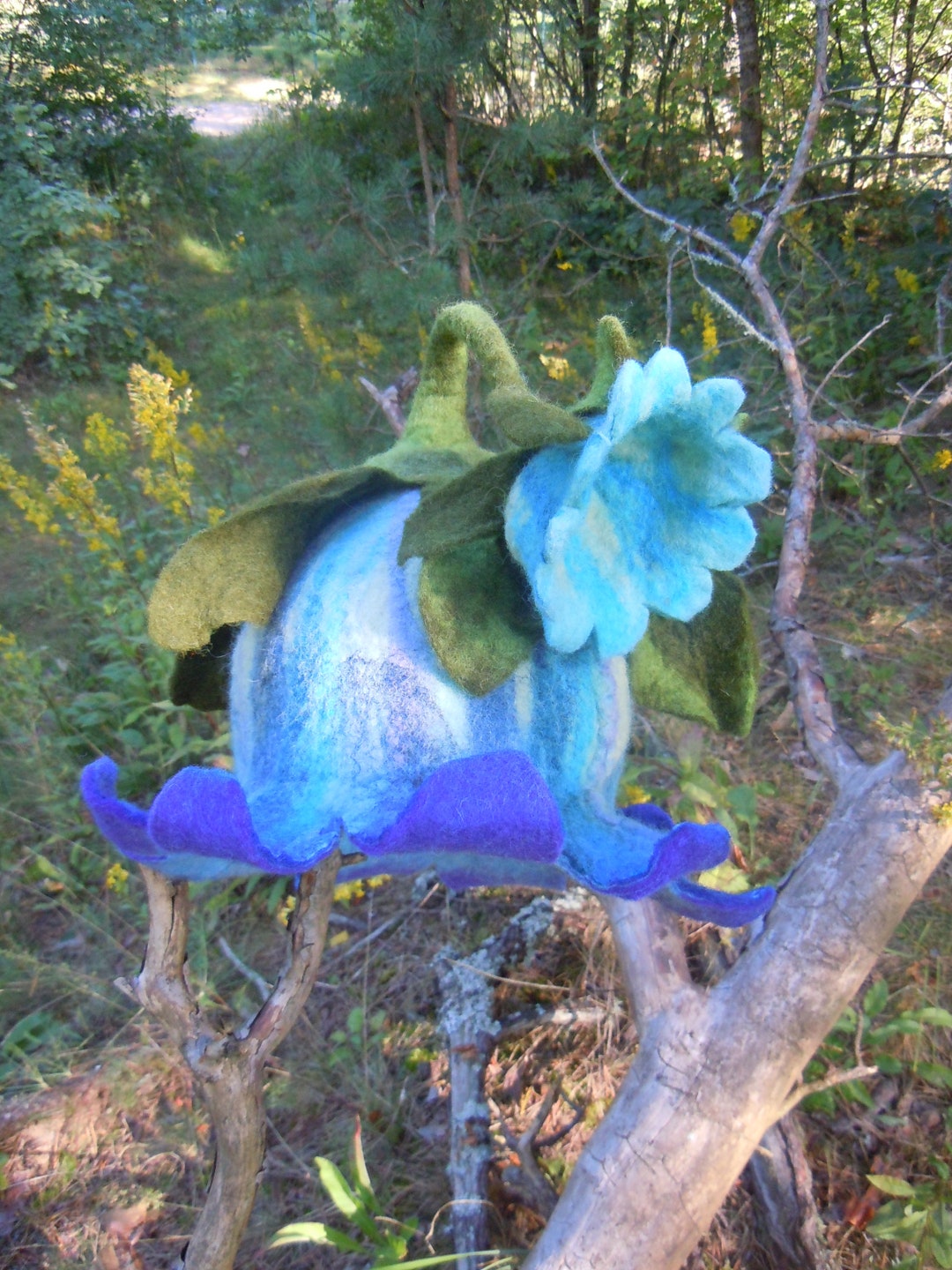 Blue Beautiful Bell Shaped Hat With a Little Flower at the End Flower ...