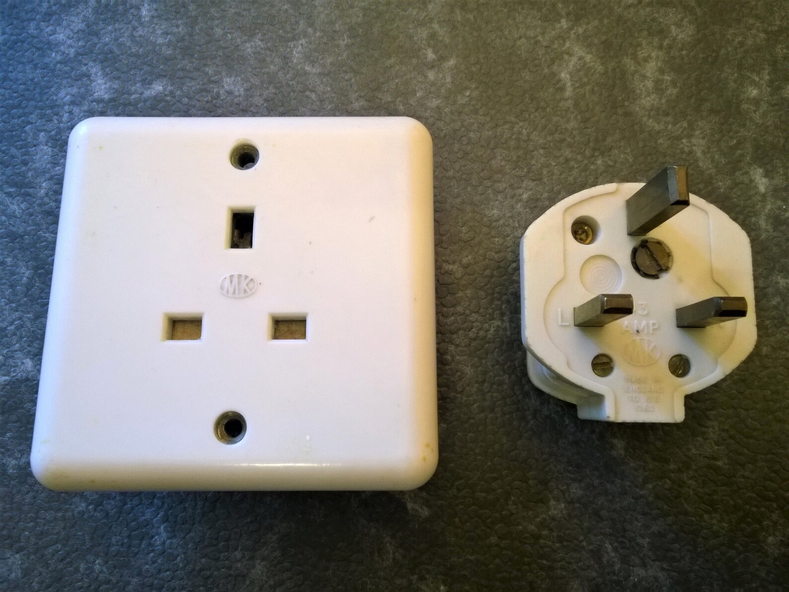 Plug socket at my grandparents house is sideways : r/mildlyinteresting