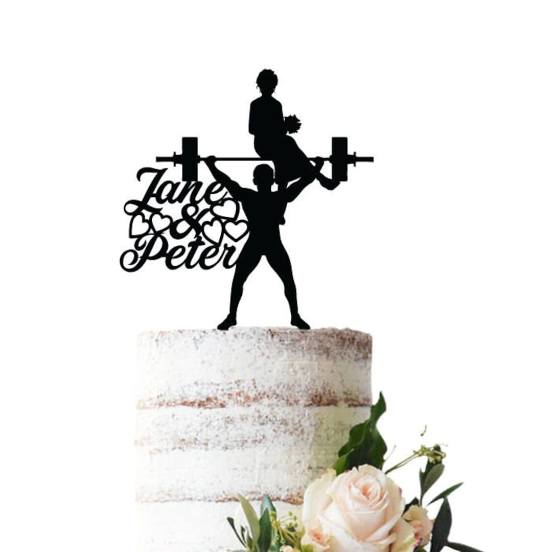 Wedding Cake Topper With a Power Lifting Groom and Bride Sitting on the ...