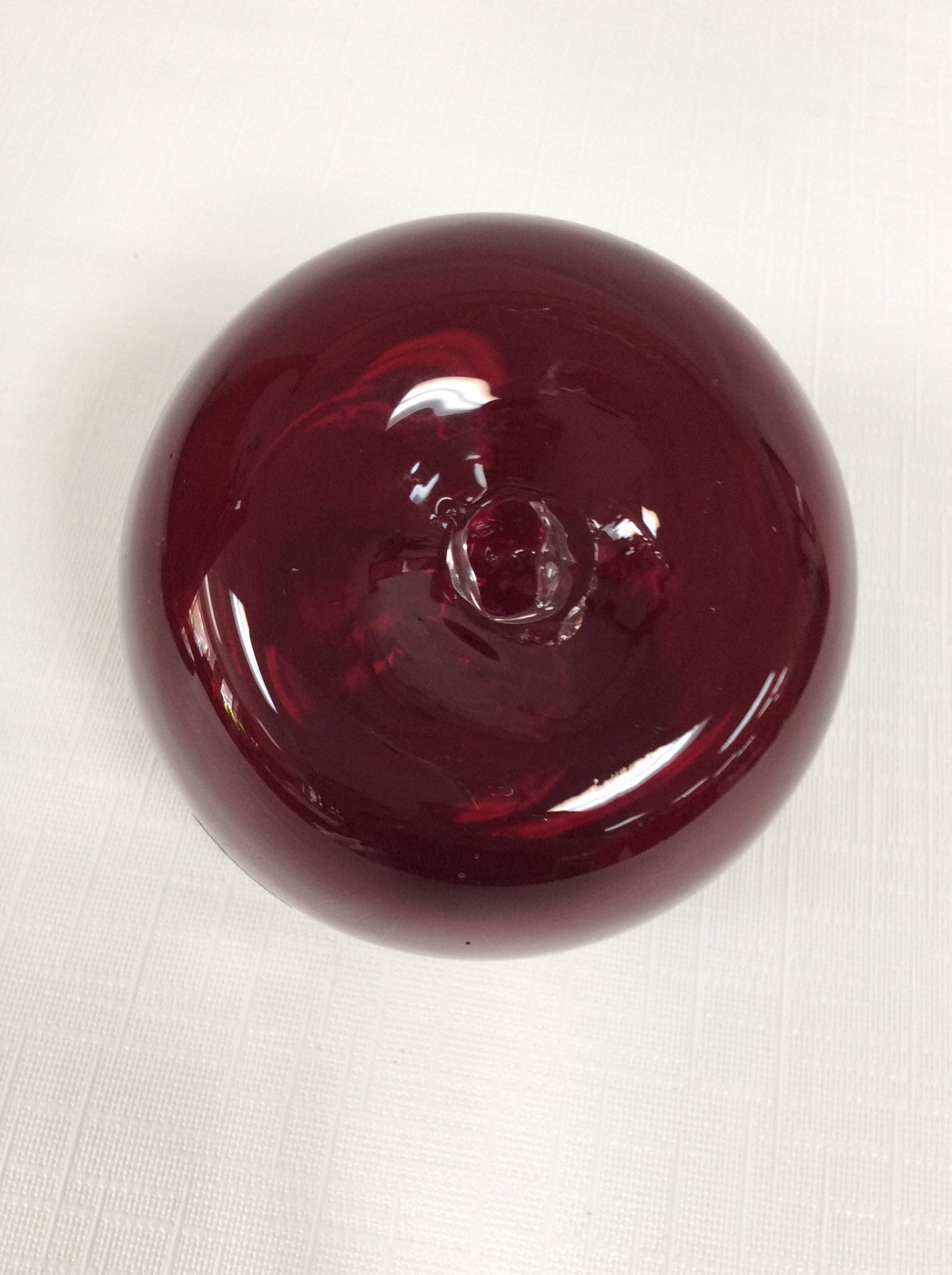 Blenko Glass ruby red apple with crystal stem.
