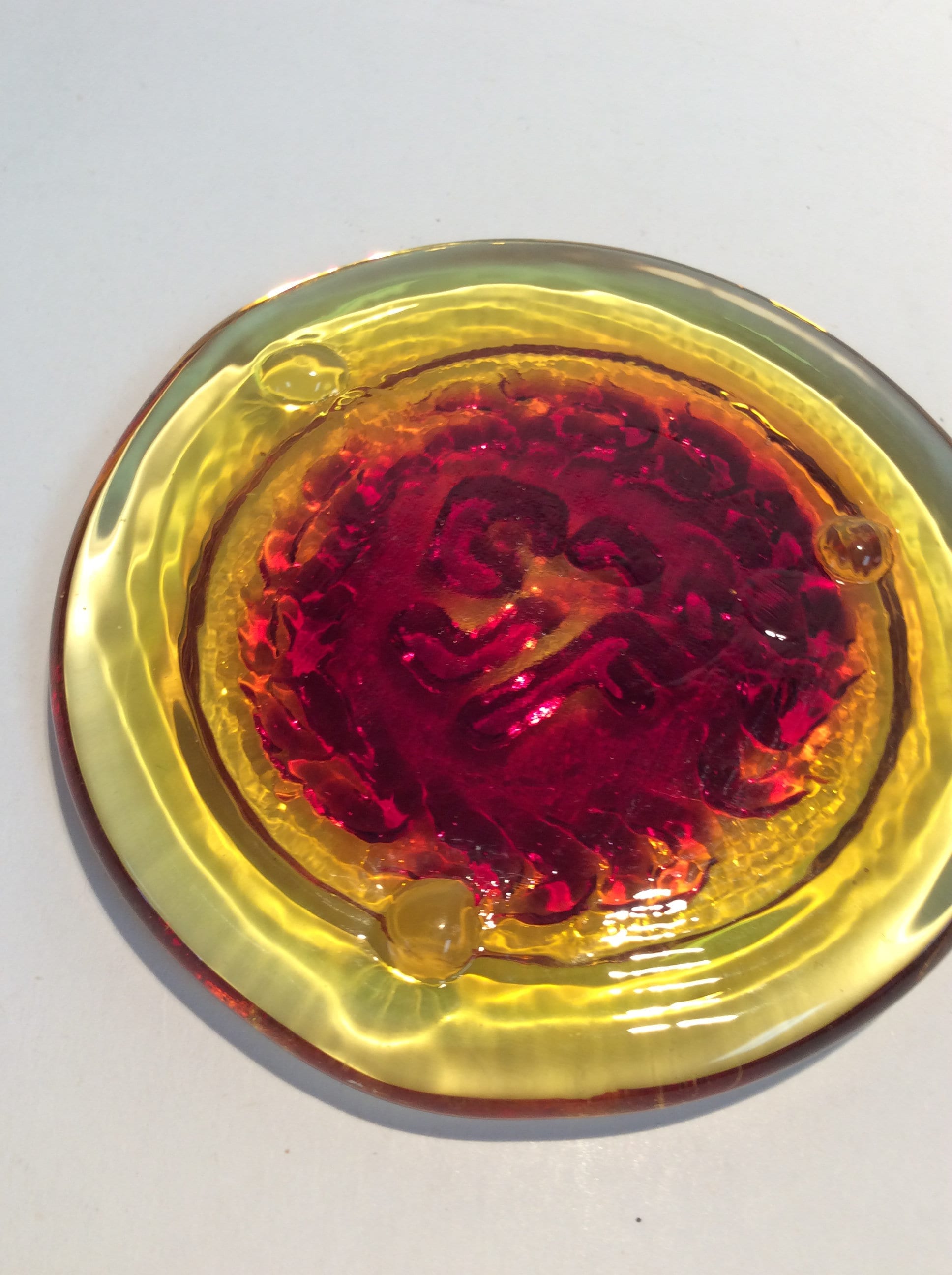 Blenko Glass 9607B blower man logo coaster, tangerine