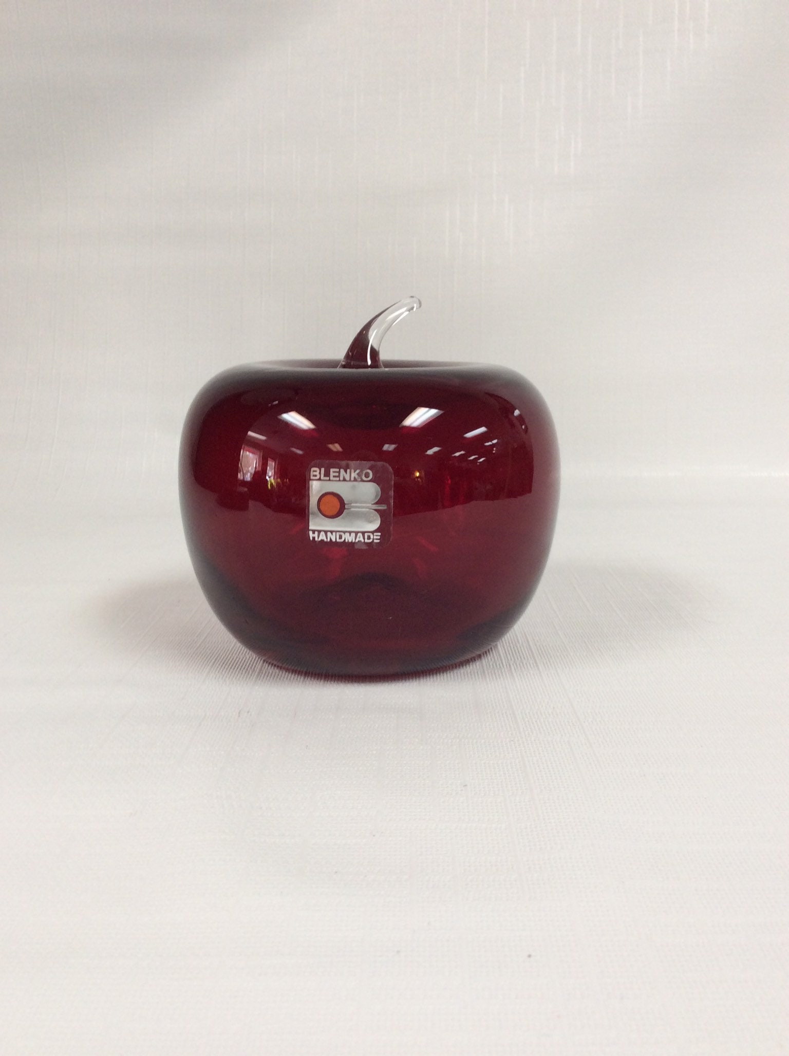 Blenko Glass ruby red apple with crystal stem.
