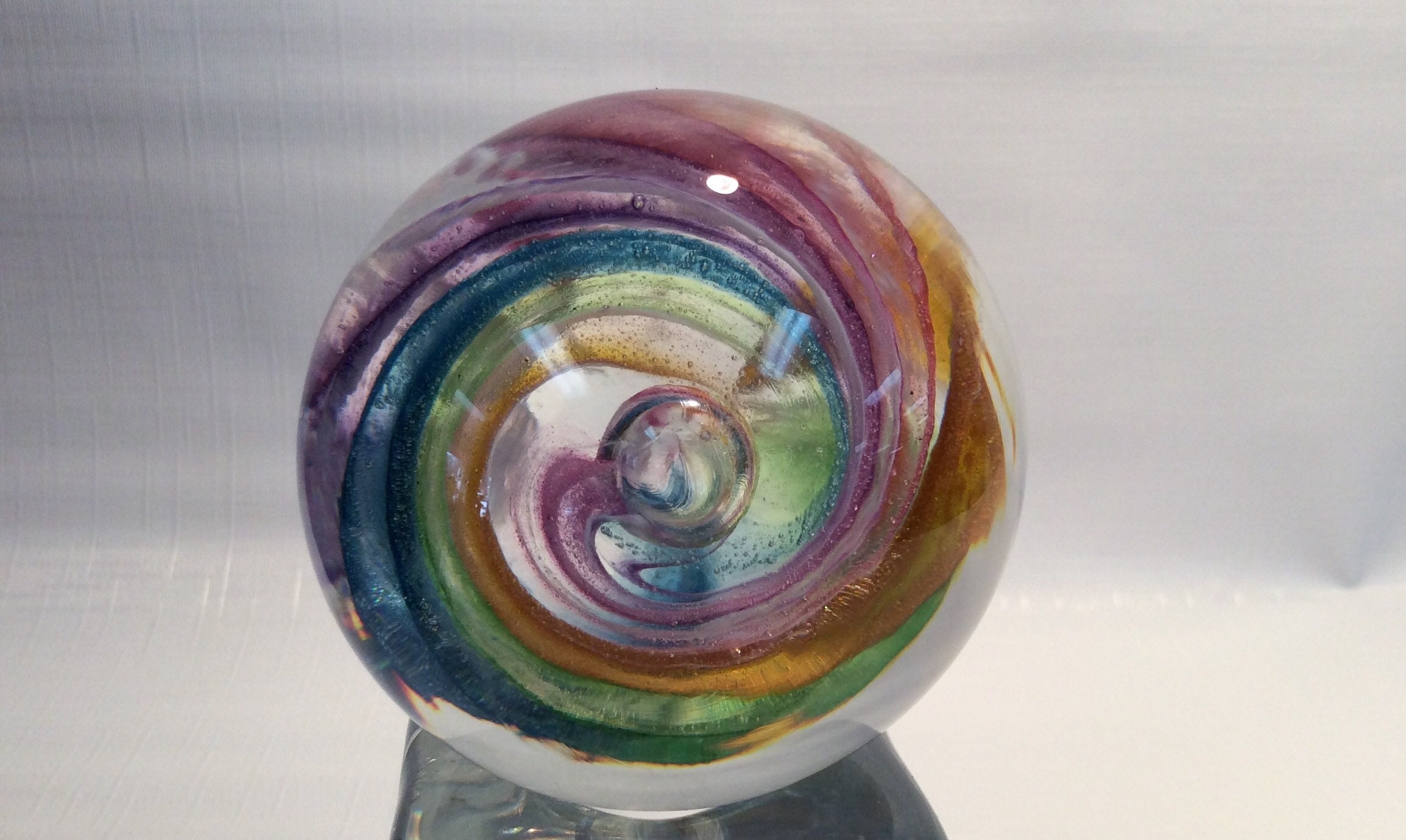 signed Marilyn Kimble hand made glass paperweight with multi colored swirls