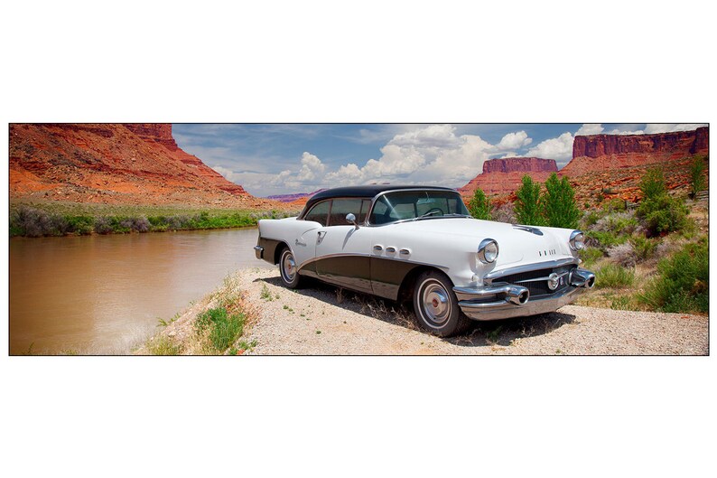 White Buick Impala Car on the River's Shore With Red Mountain Landscape ...