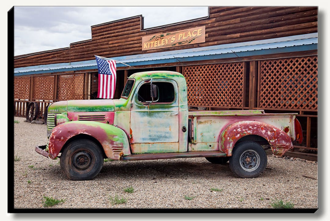 Old Rusty Classic Farm Truck and American Flag in Front of a Building ...