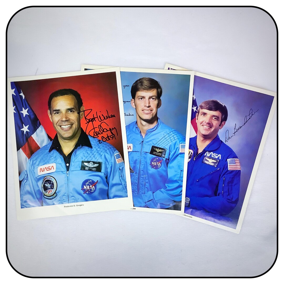 Signed NASA Astronaut Photographs From the 1990s, Lot of Three: Daniel ...