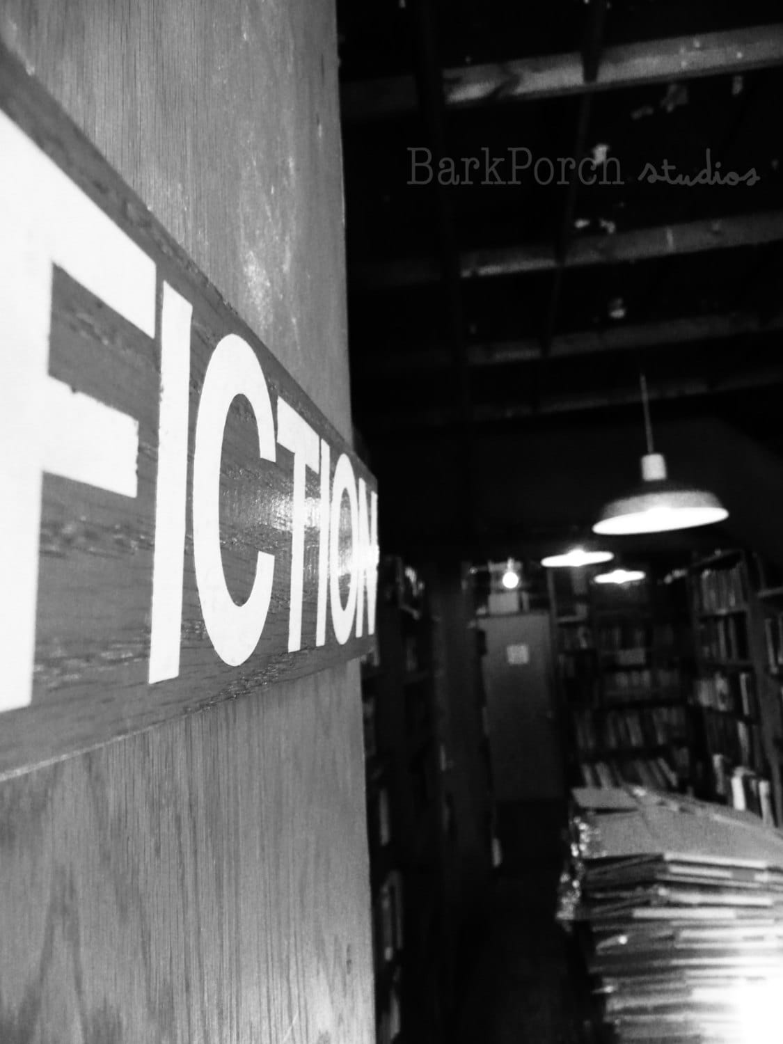 FICTION: Book Stack Sign in a Used Bookstore in Boston, MA. Black and ...