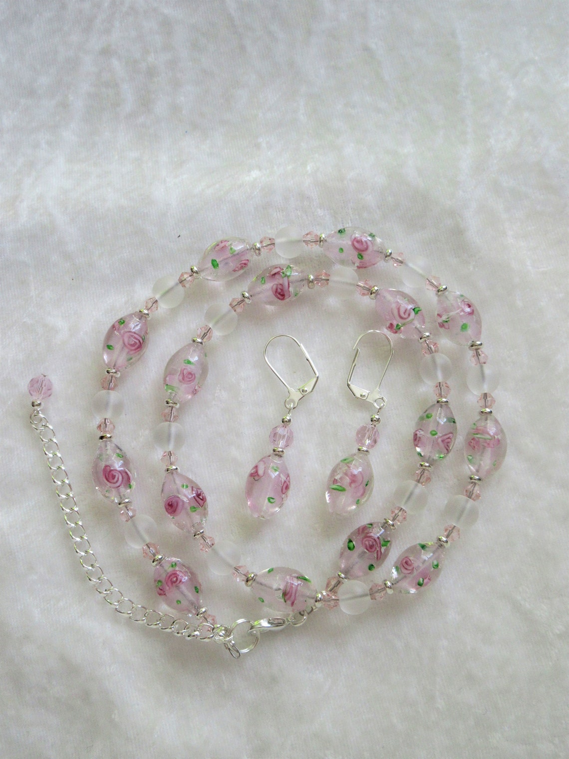 Lampworked pink jewelry set frosted ovals with inlaid flowers | Etsy